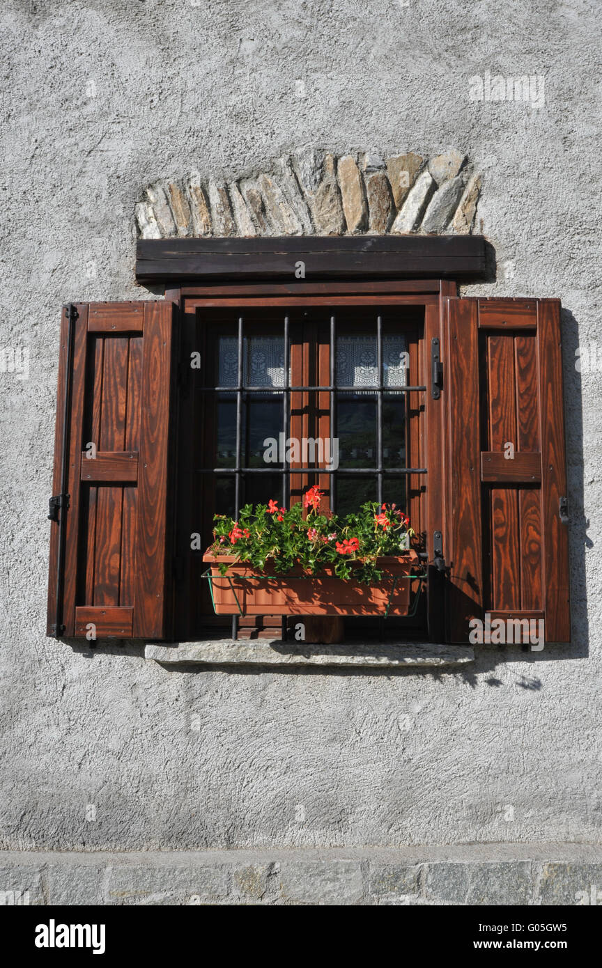 Window of an alpine house Stock Photo - Alamy
