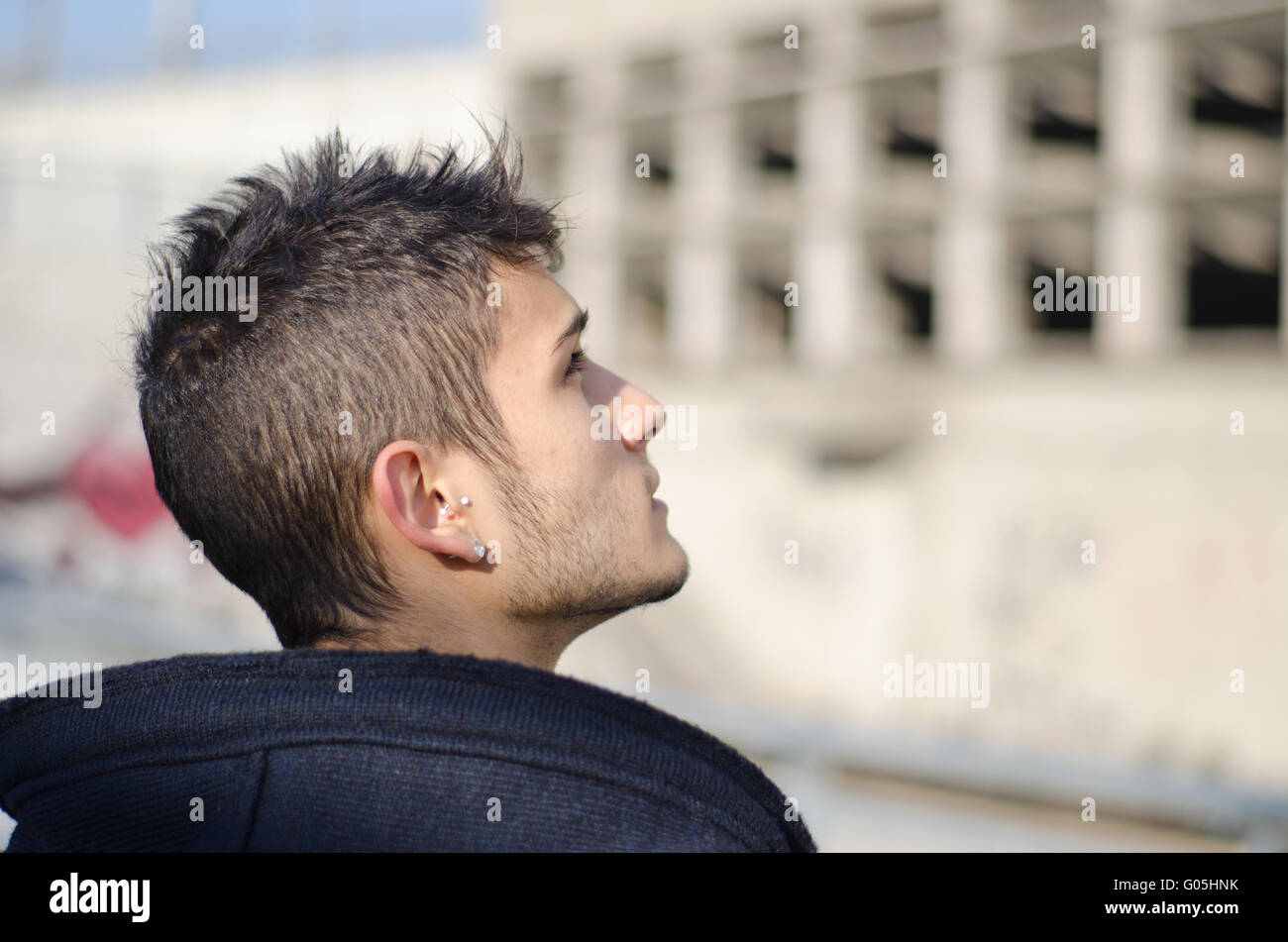 Handsome young man's profile looking up Stock Photo - Alamy