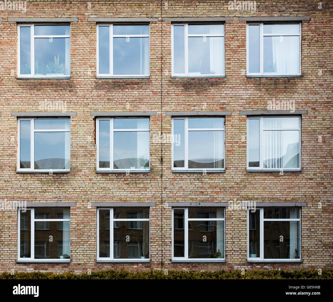 Wall of a residential block of flats with balconies windows Stock Photo ...