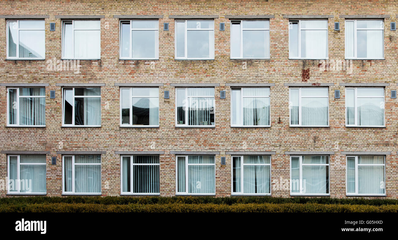 Wall of a residential block of flats with balconies windows Stock Photo ...