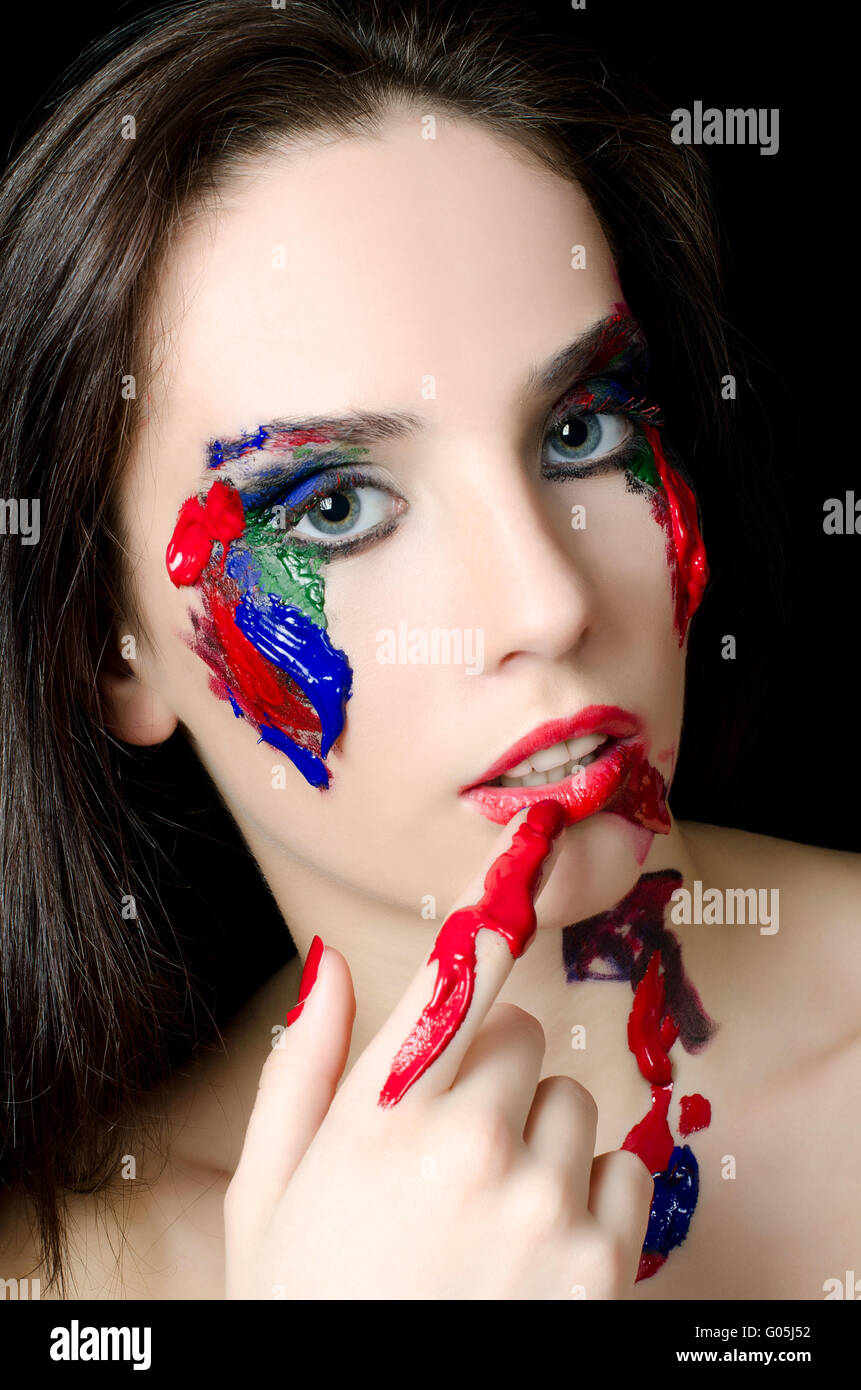 The beautiful woman with a paint on the face Stock Photo - Alamy