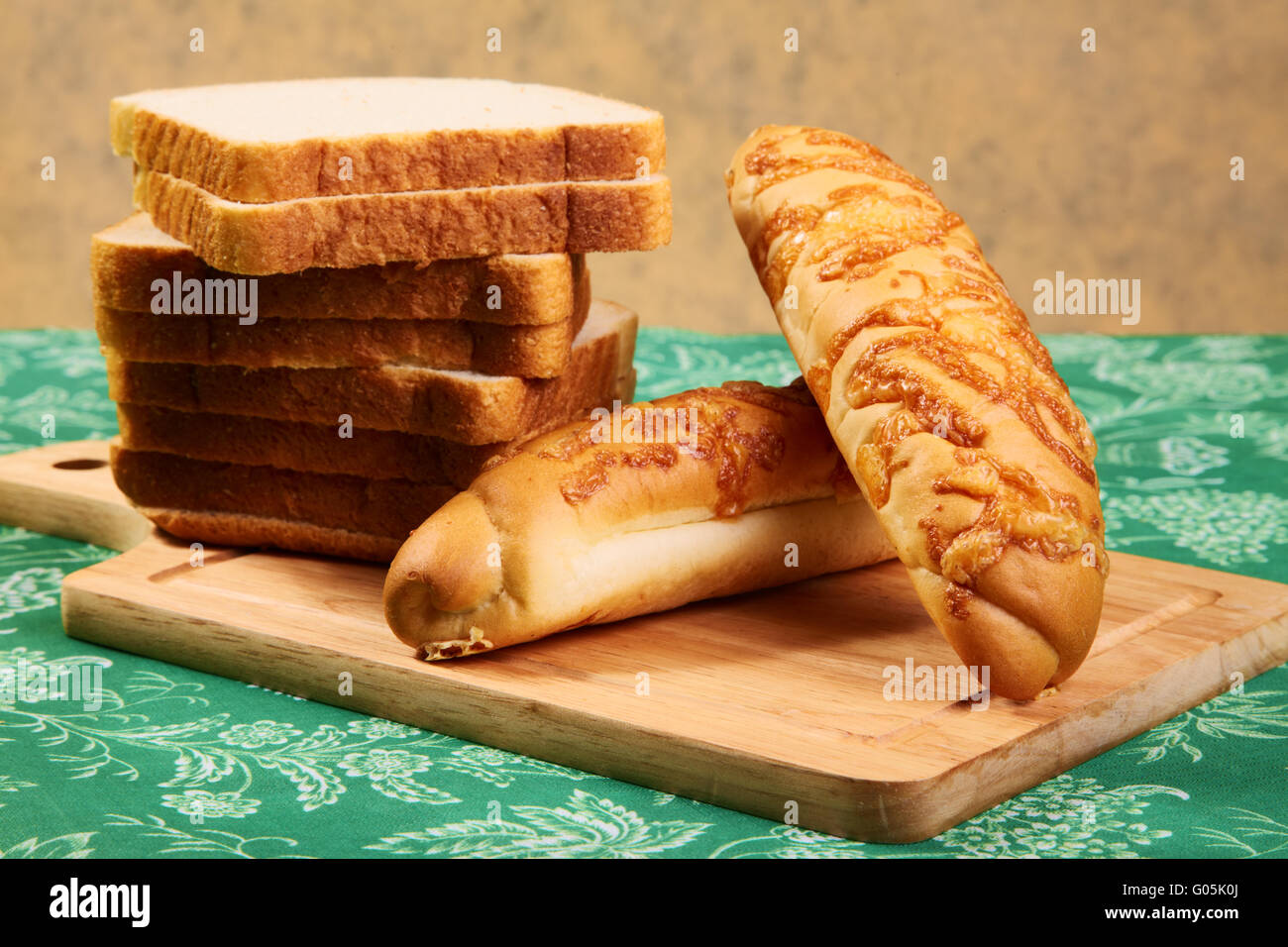 Pieces of bread and roll on a kitchen table Stock Photo - Alamy