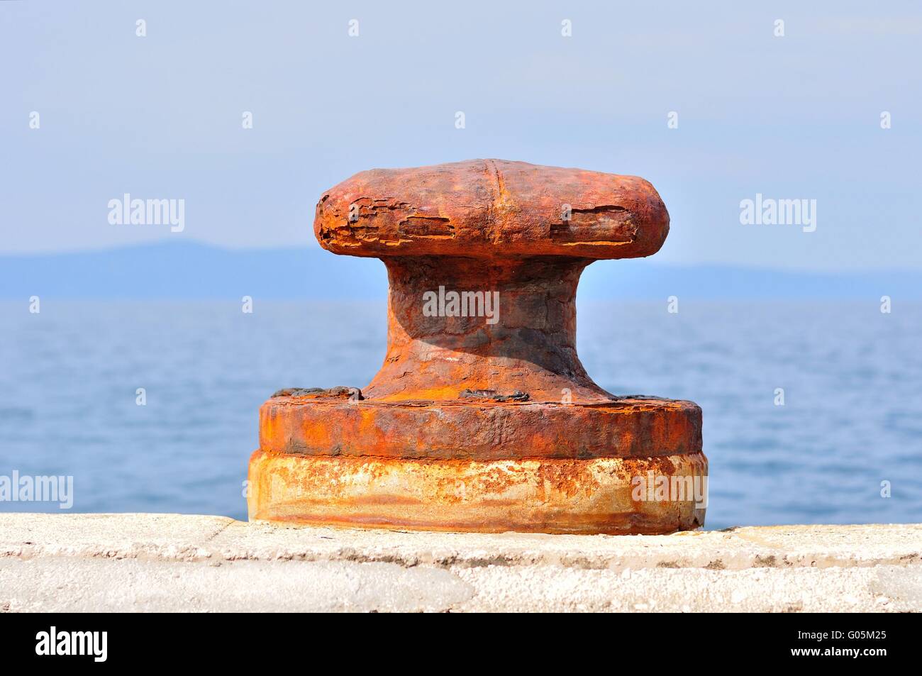 Old, rusty mooring bollard on port of Podgora, Croatia Stock Photo - Alamy