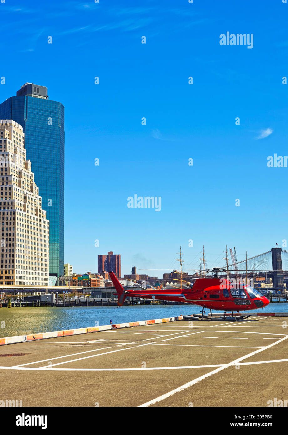 New York, USA - April 25, 2015: Red Helicopter landing on helipad in ...