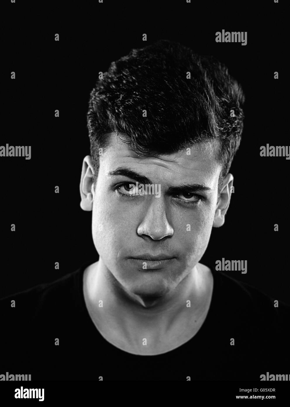 confused young man studio portrait Stock Photo - Alamy