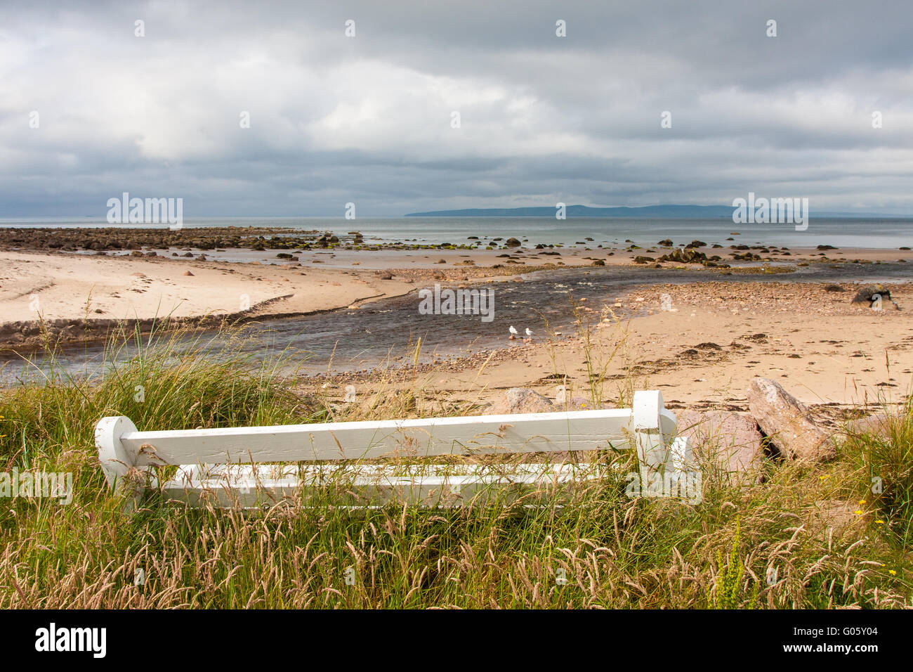 Bench on the beach Stock Photo - Alamy
