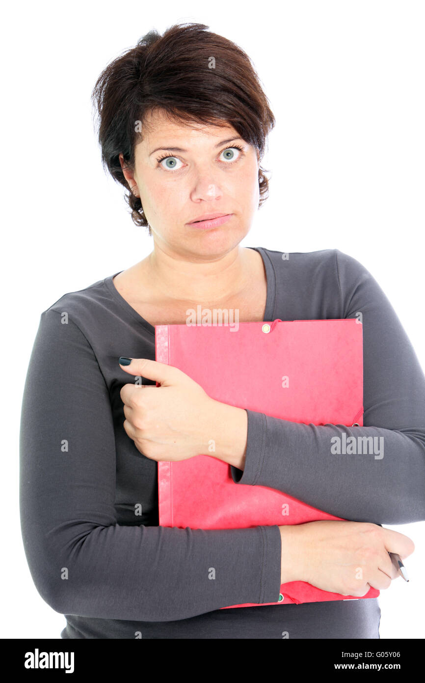 Exasperated, overworked woman clutching paperwork Stock Photo - Alamy