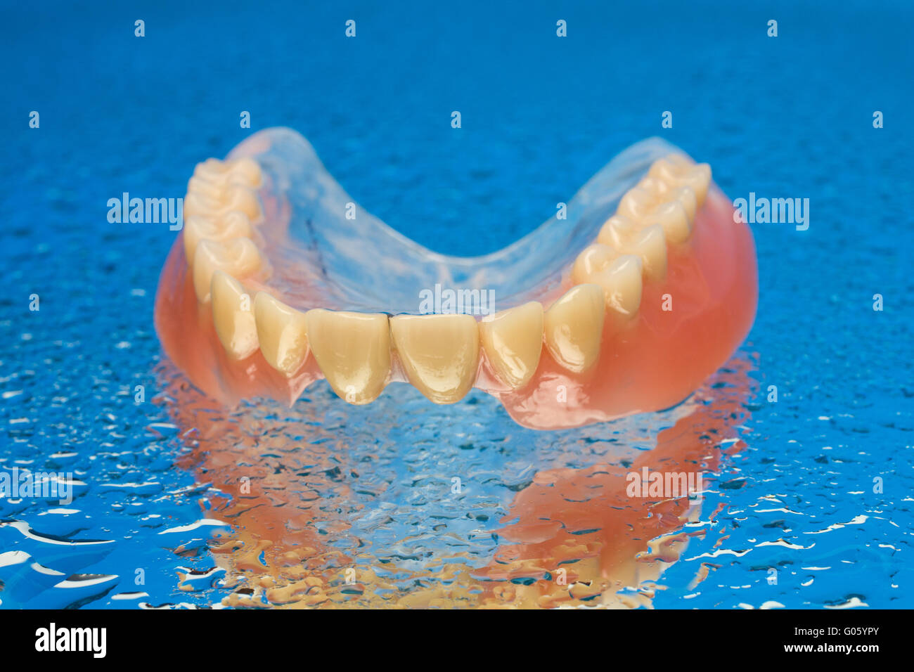 Denture Blue water drops Stock Photo - Alamy