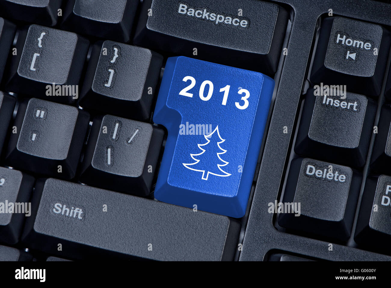 Enter button on computer keyboard with Christmas tree Stock Photo - Alamy