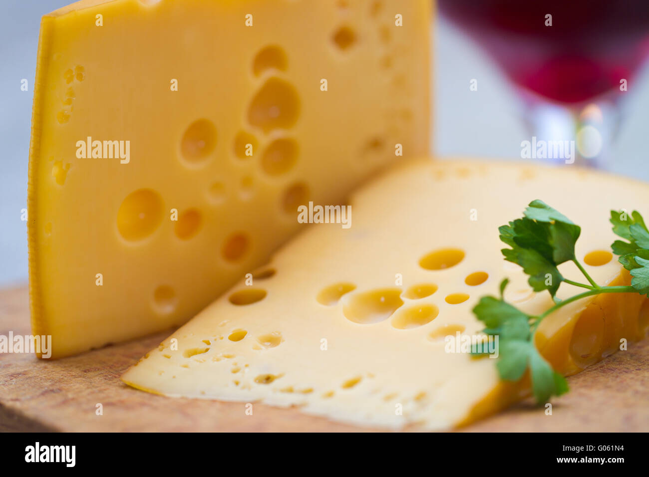 Emental cheese and wine shoot with short DOF Stock Photo - Alamy
