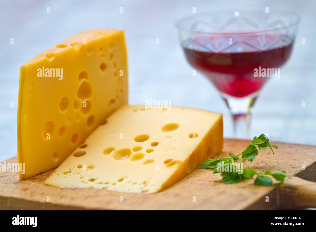 Emental cheese and wine shoot with short DOF Stock Photo - Alamy