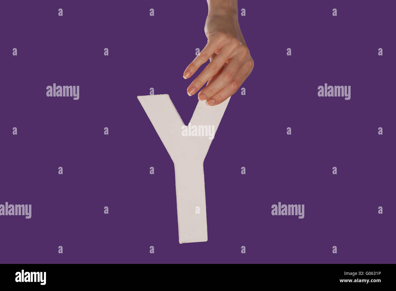 Female hand holding up the letter Y from top Stock Photo - Alamy