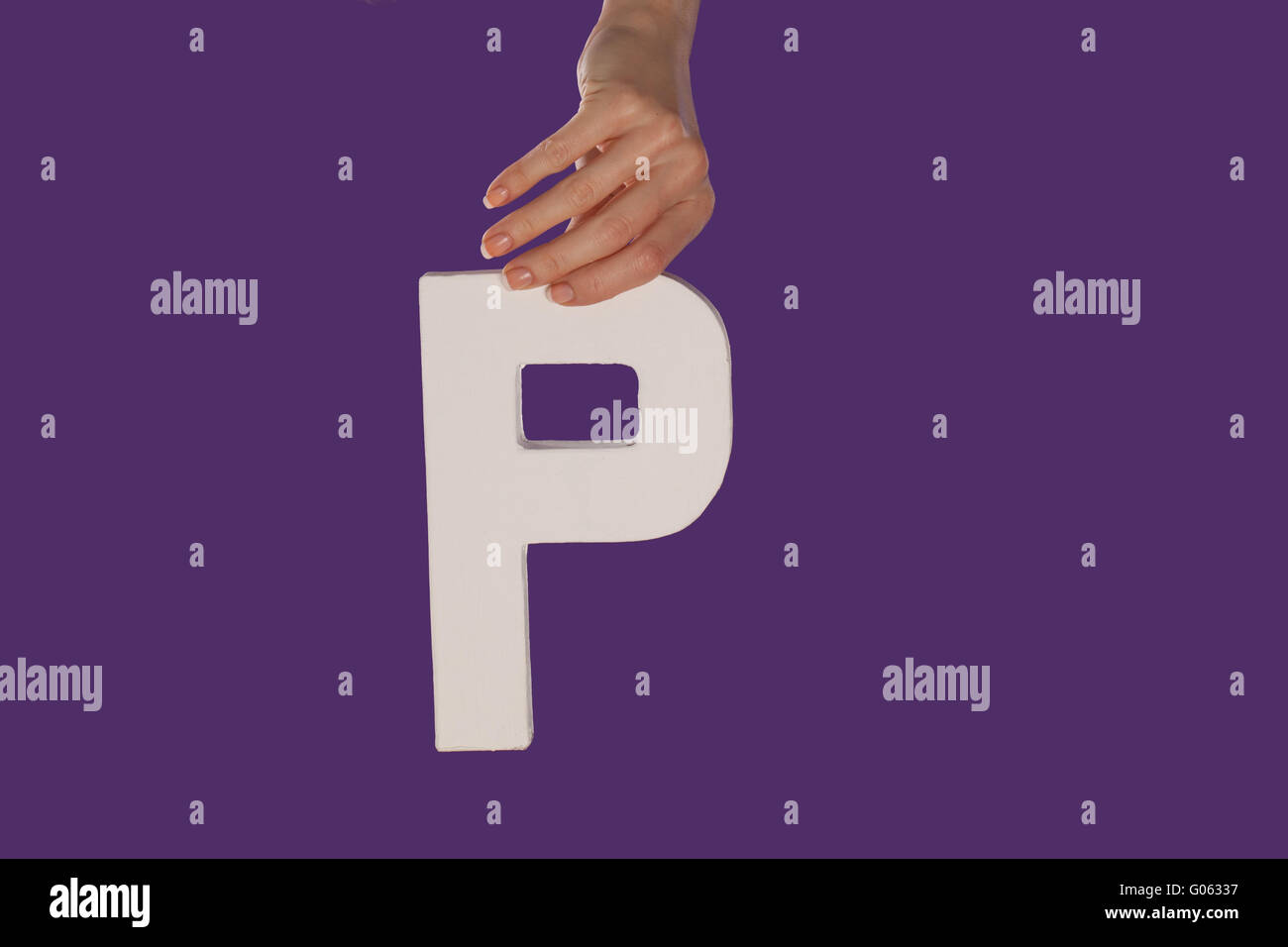 Female hand holding up the letter P from top Stock Photo - Alamy