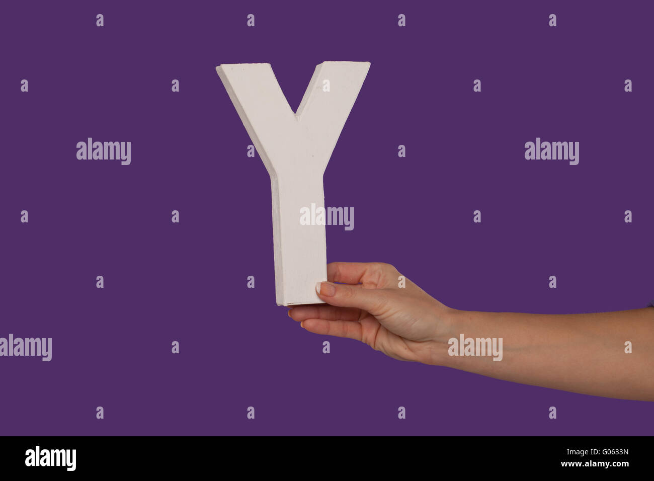 Female hand holding up the letter Y from the right Stock Photo - Alamy