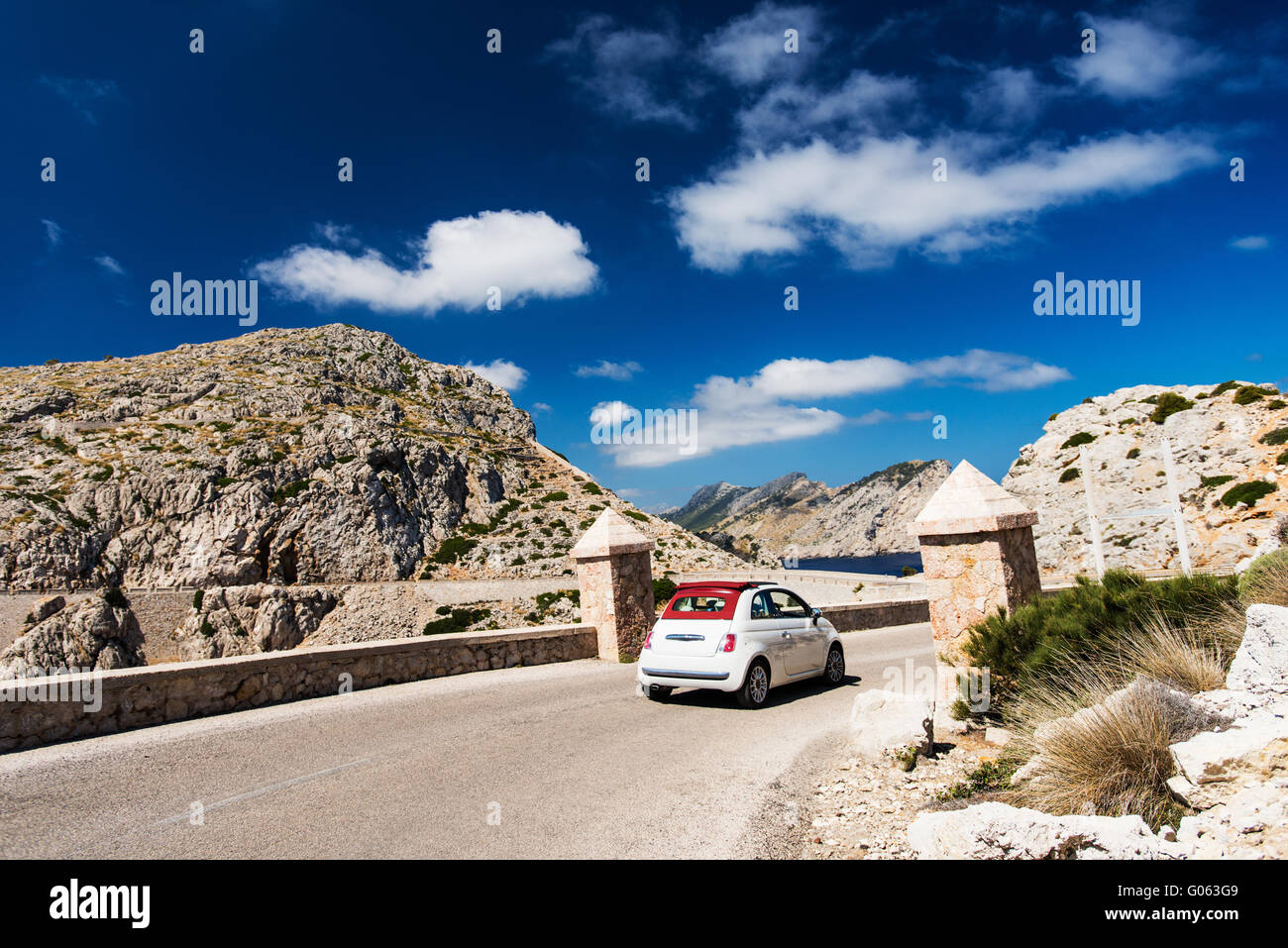 Small european car on winding road of Mallorca Spain Stock Photo - Alamy