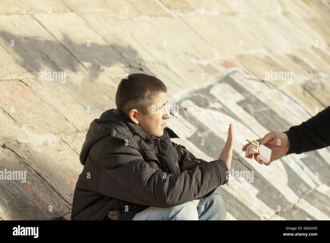 The boy flatly refuse from the offered cigarettes Stock Photo - Alamy