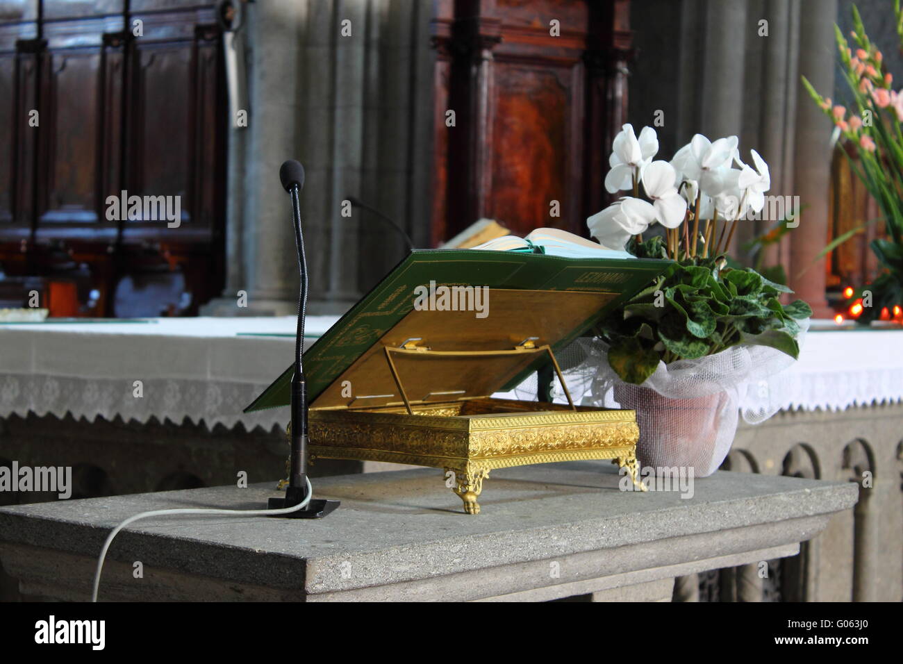 Open Bible on an altar of a catholic church Stock Photo - Alamy