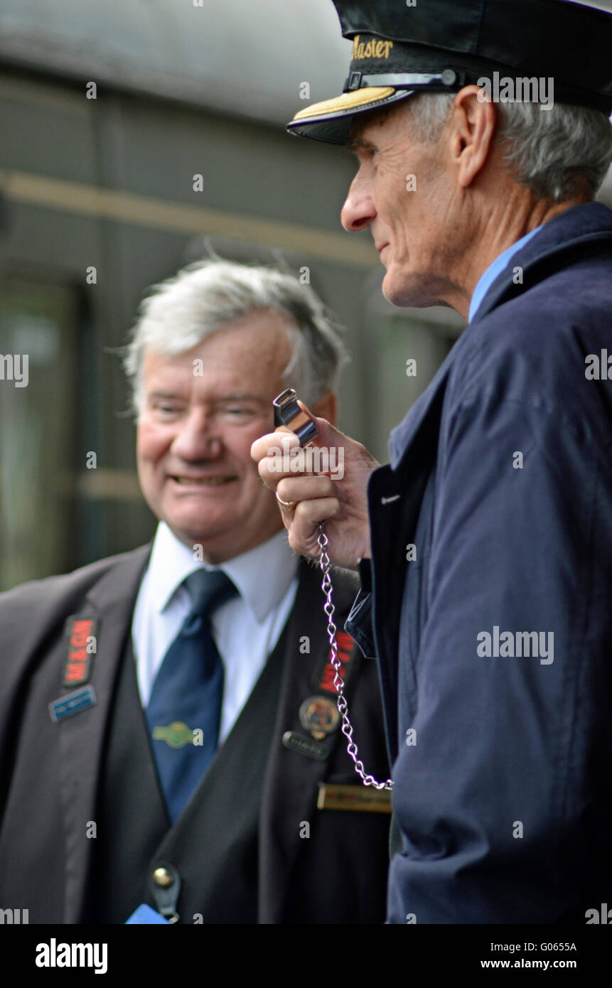 station master with whistle Stock Photo - Alamy