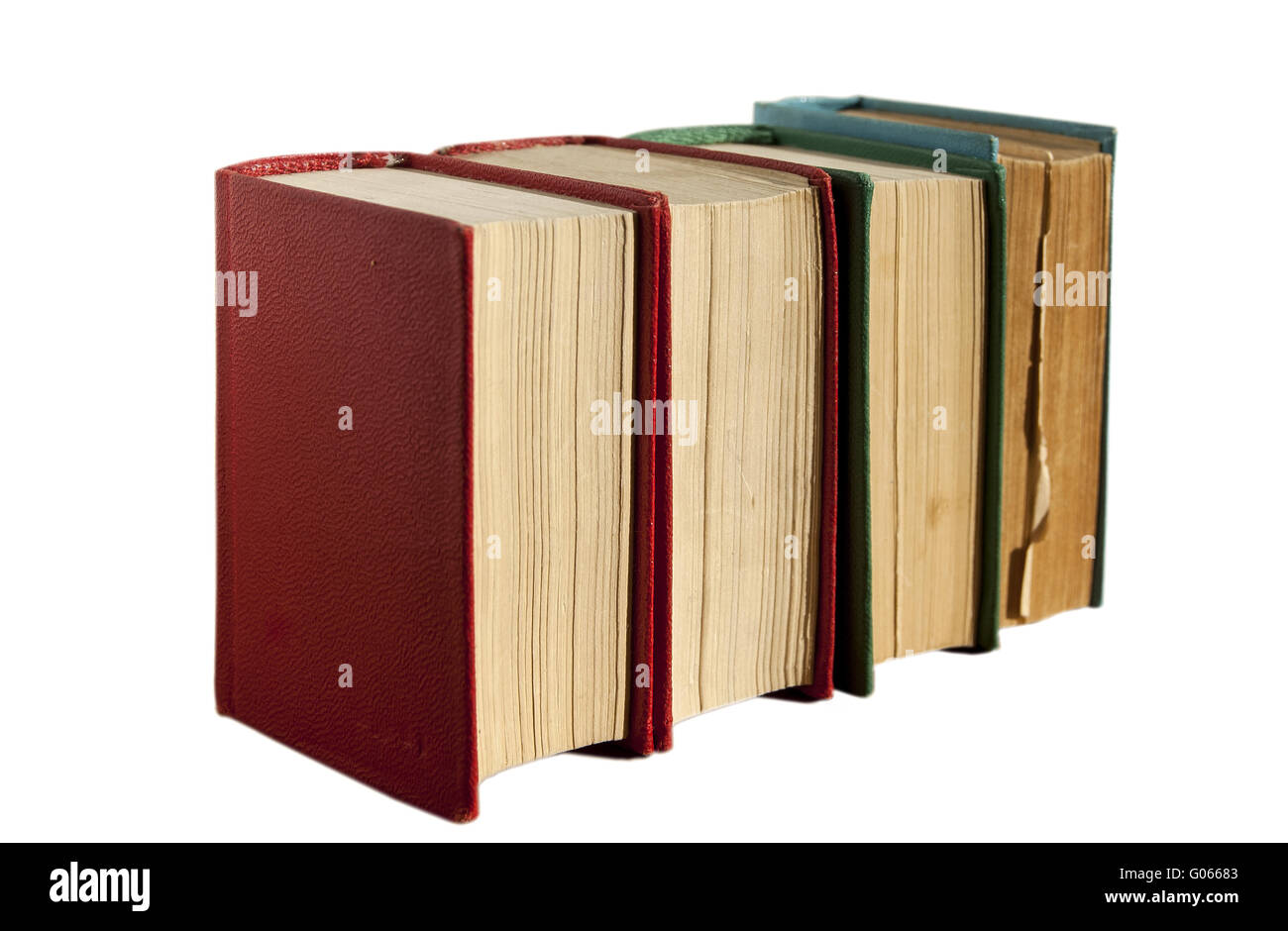 Four old books in row isolated on white Stock Photo - Alamy