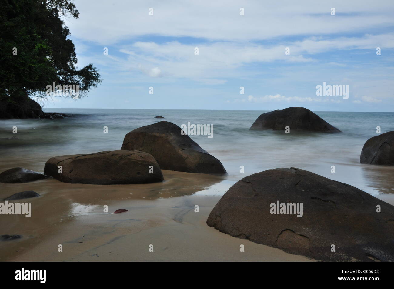 stones at small sandy beach Stock Photo - Alamy