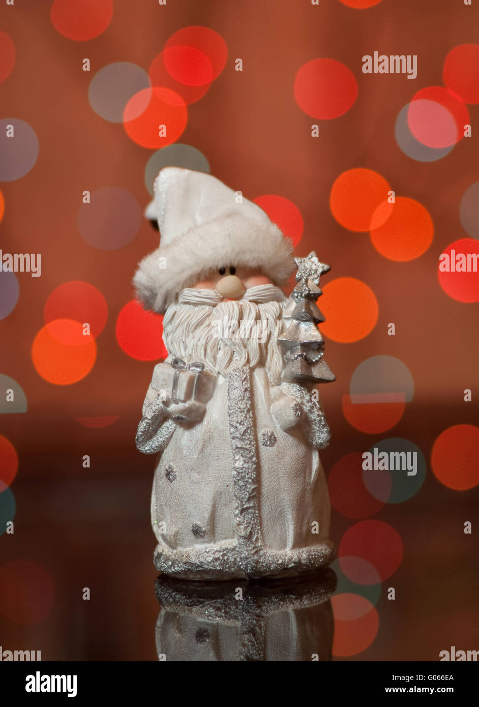 Santa Claus - a Christmas toy on a fir-tree Stock Photo - Alamy