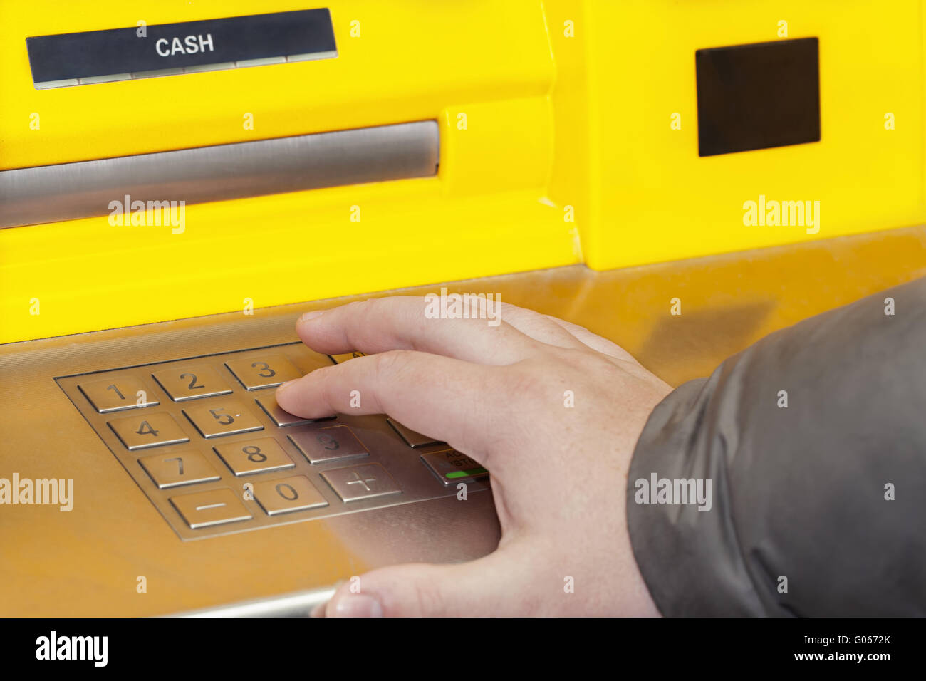 Man's hand near the cash machine on the pin code Stock Photo - Alamy