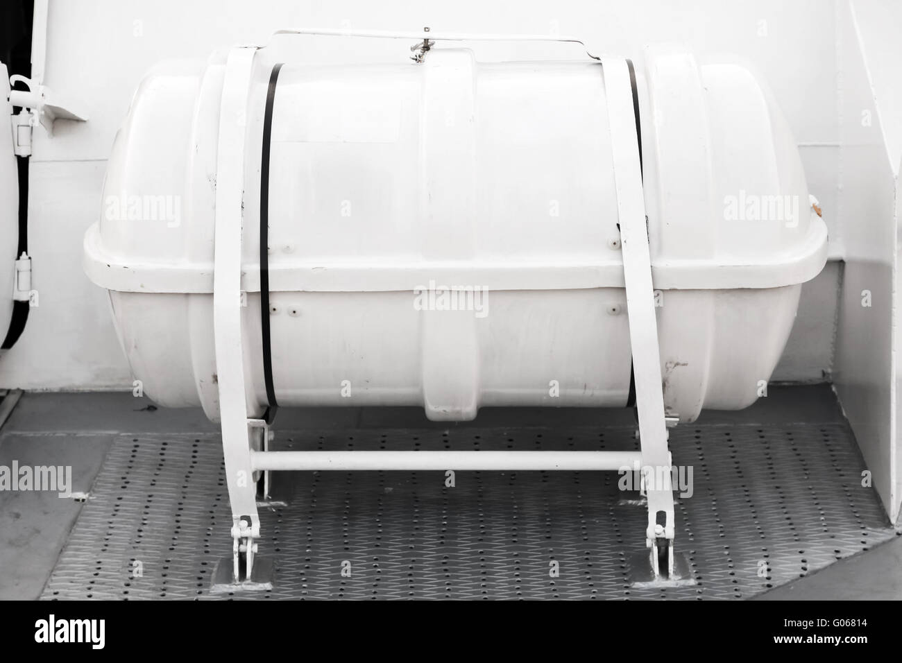 Inflatable liferaft in hard-shelled white canister. Modern passenger ...