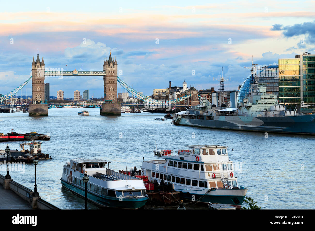 Sunset on the London cityscape, showing Tower Bridge, Thames river end ...