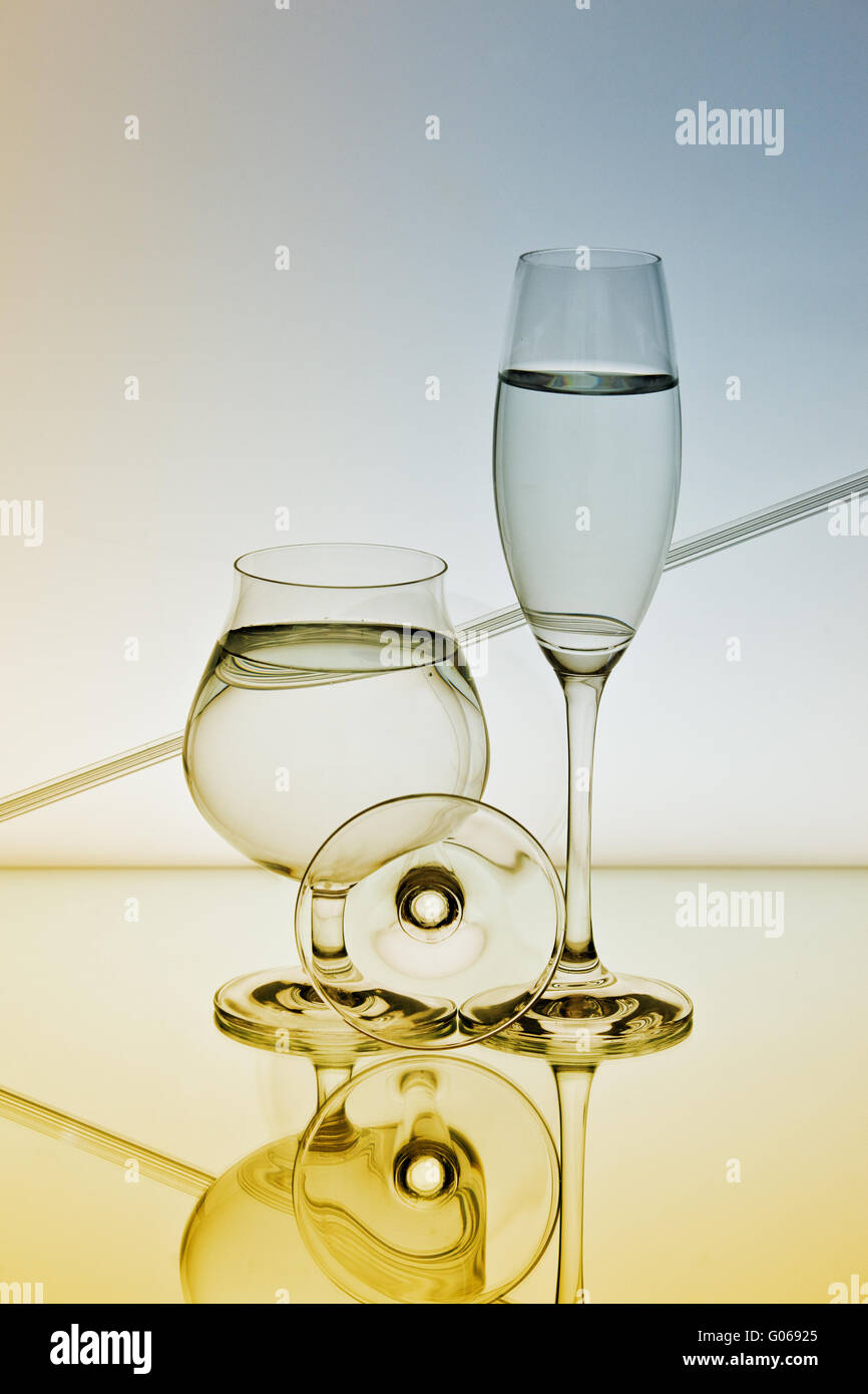 Champagne glasses on Mirror surface and smooth gradient background ...