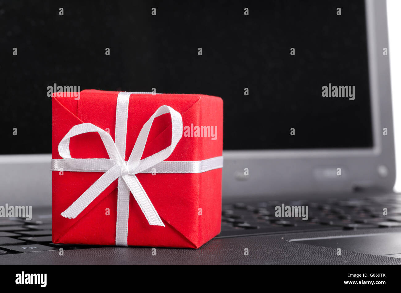 gift on a laptop keyboard Stock Photo - Alamy