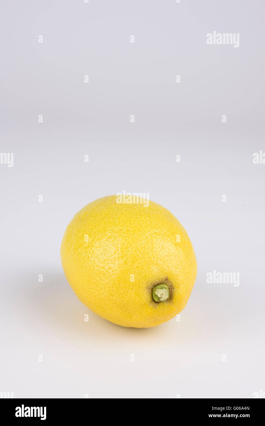 Single whole lemon on a white background Stock Photo - Alamy