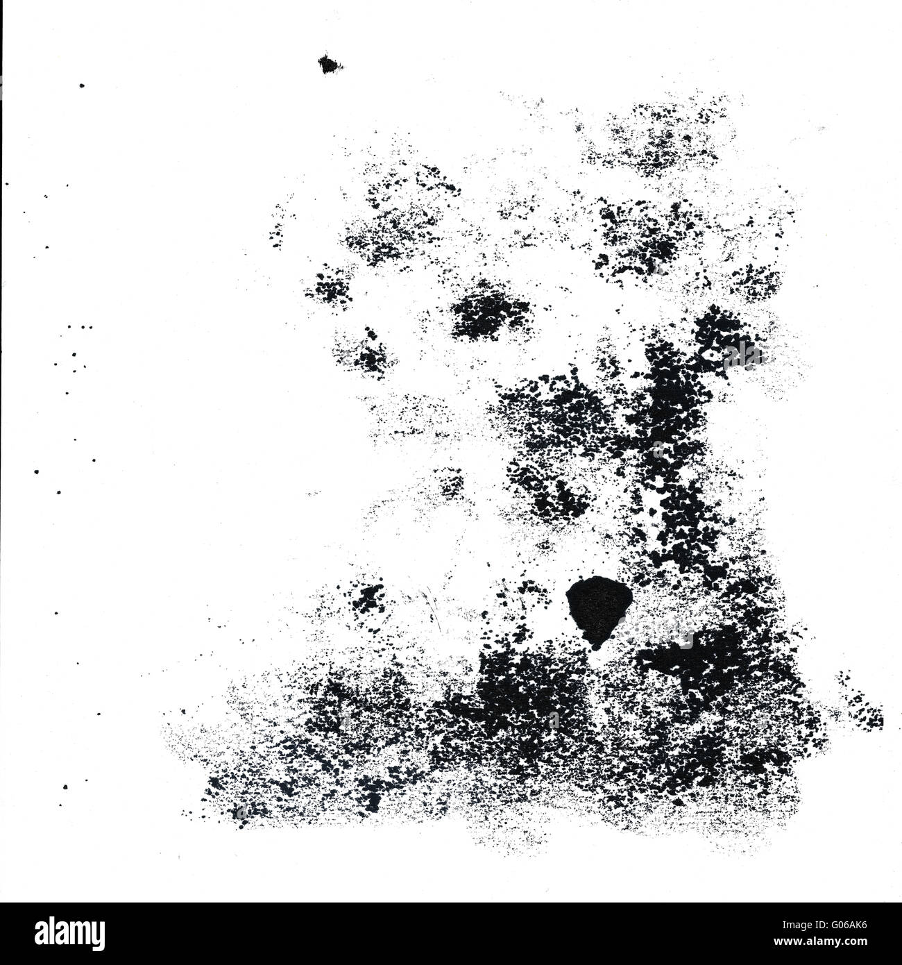 Black ink spots on a white background Stock Photo - Alamy