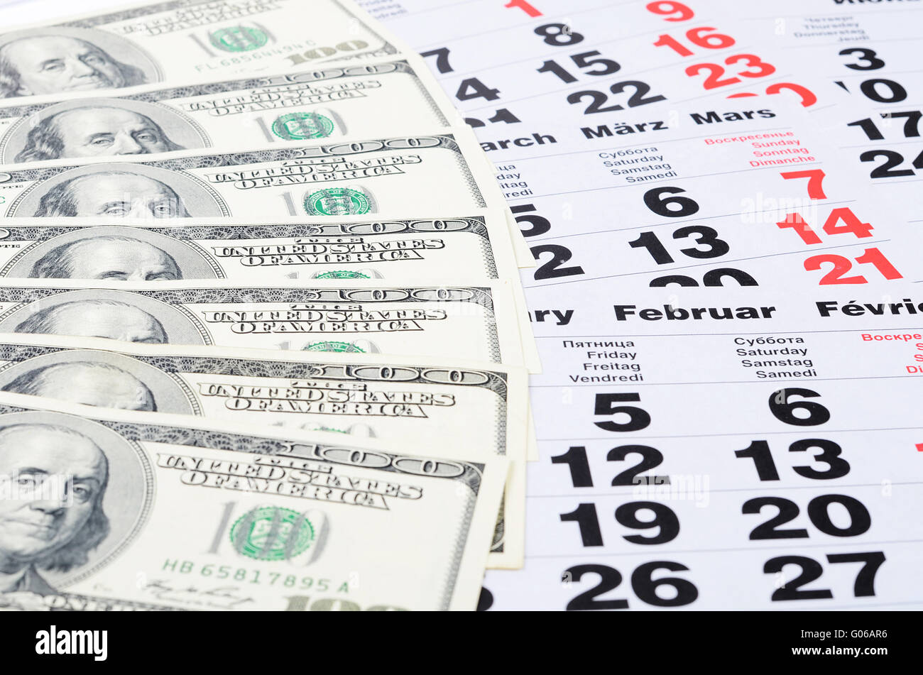 Banknotes of dollars on calendar sheets closeup Stock Photo - Alamy