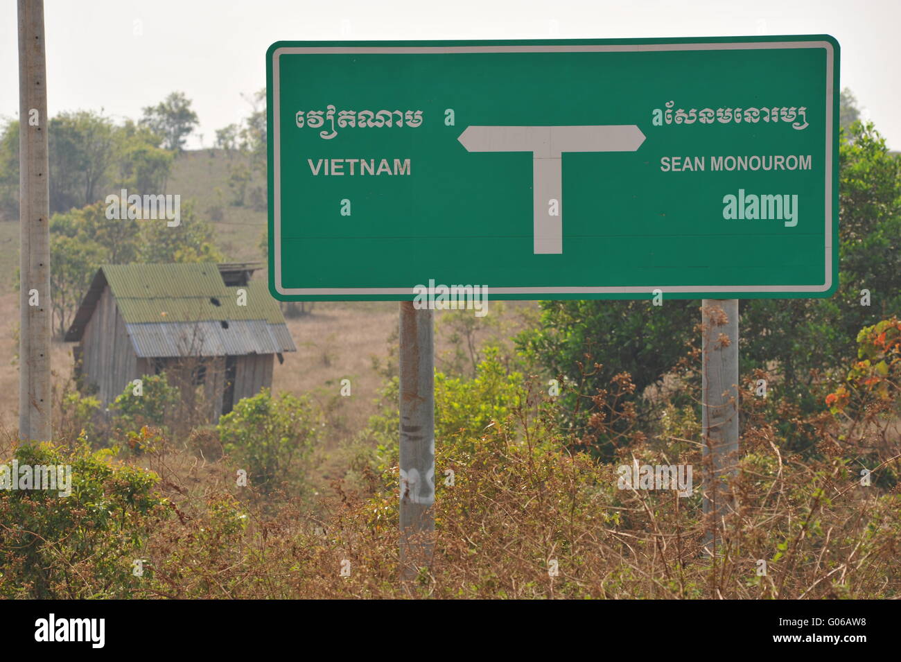 Bilingual road sign near the Cambodian / Vietnamese border, Mondulkiri ...