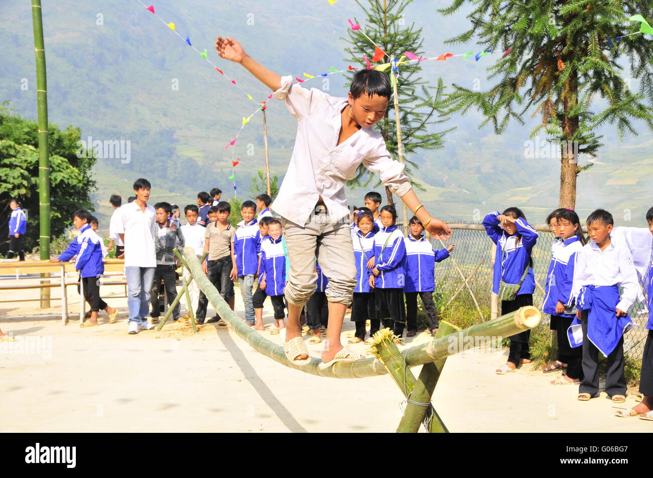 Hmong children playing a balance game Stock Photo - Alamy