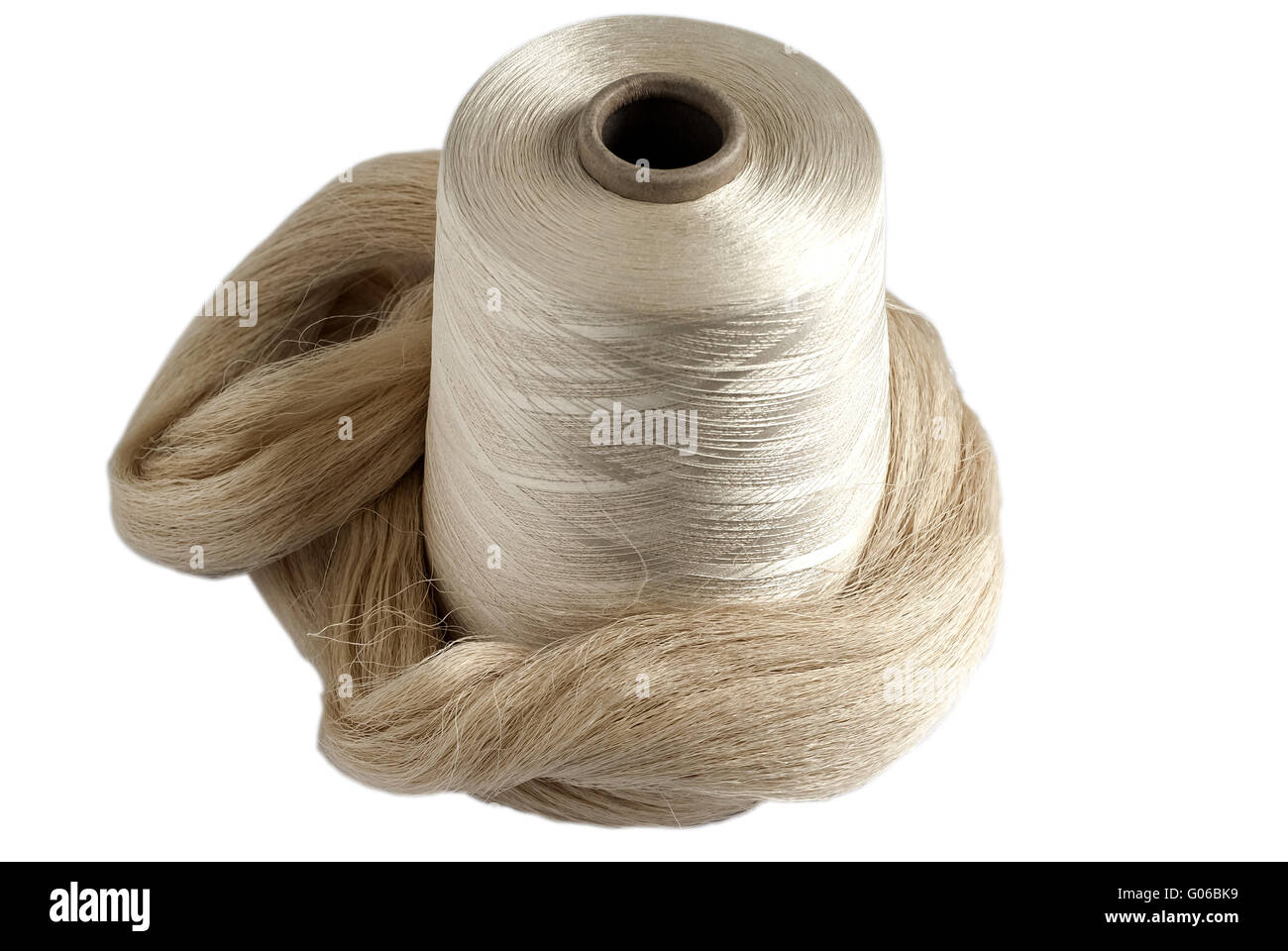 Silk yarn bobbin and raw silk skein isolated on wh Stock Photo - Alamy