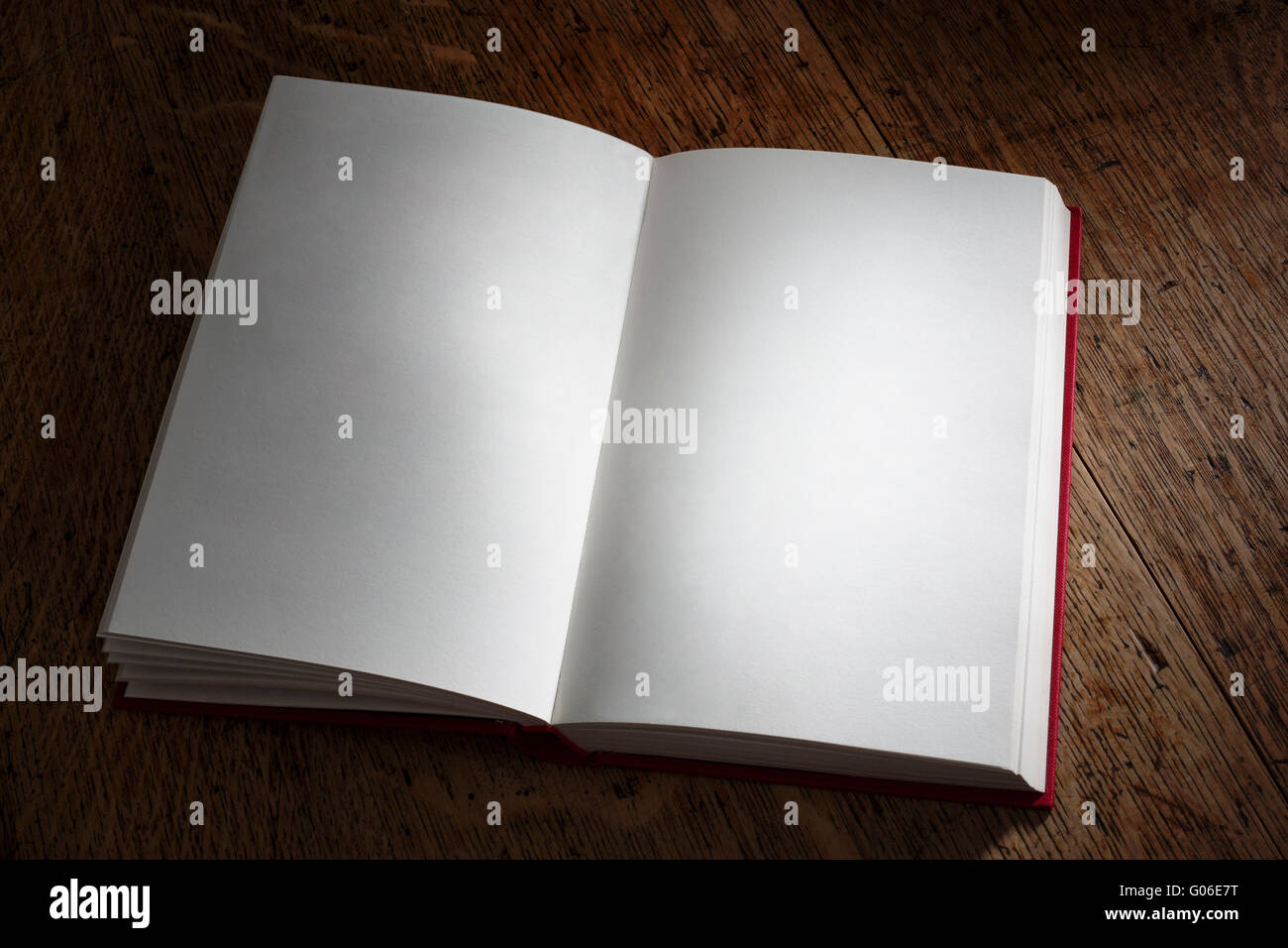Open book on an angle with blank white pages on oak background Stock ...