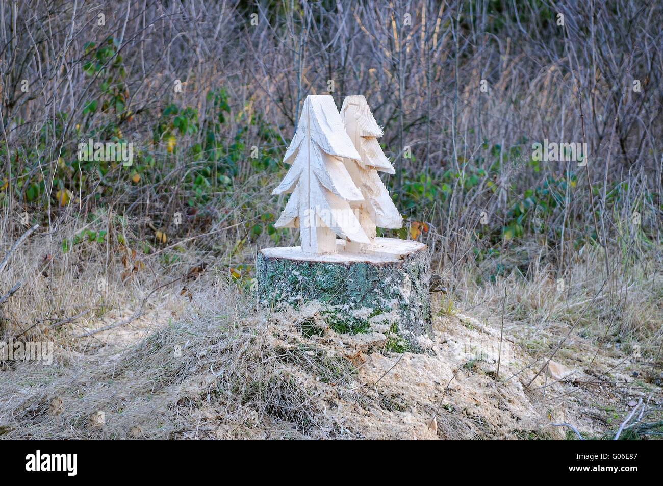 Christmas tree in the tree trunk-art in the forest Stock Photo - Alamy