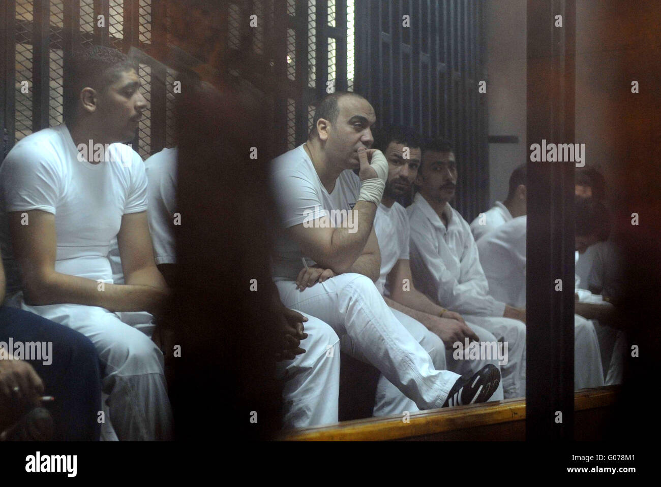 Cairo, Egypt. 30th Apr, 2016. Egyptian defendants wait behind bars for ...