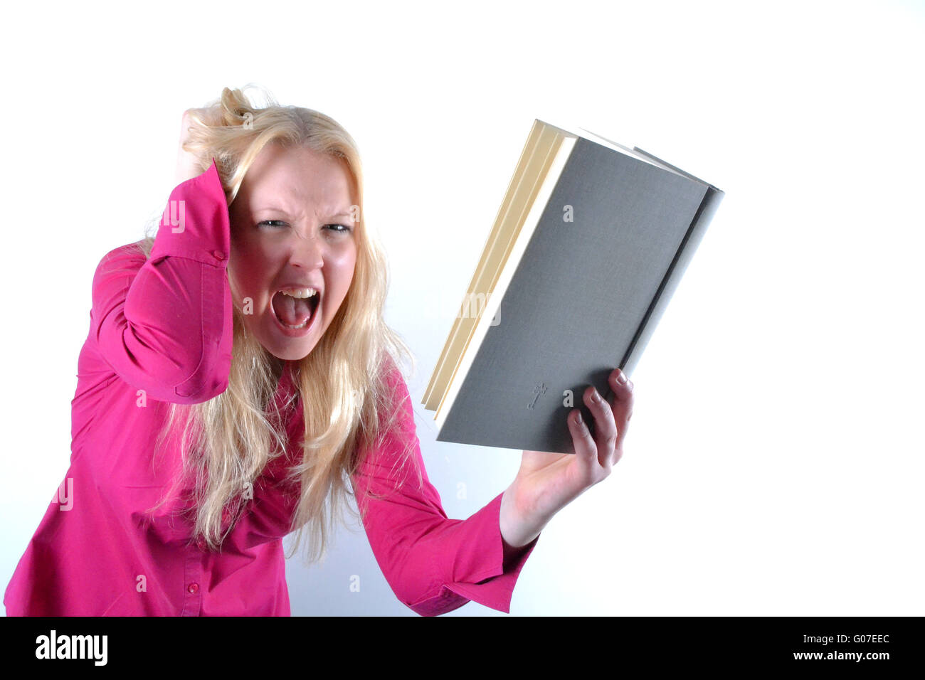 Young blonde woman who is annoyed by the read Stock Photo - Alamy
