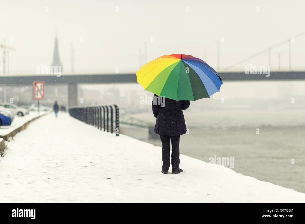 single woman with colorful umbrella in the winter Stock Photo - Alamy