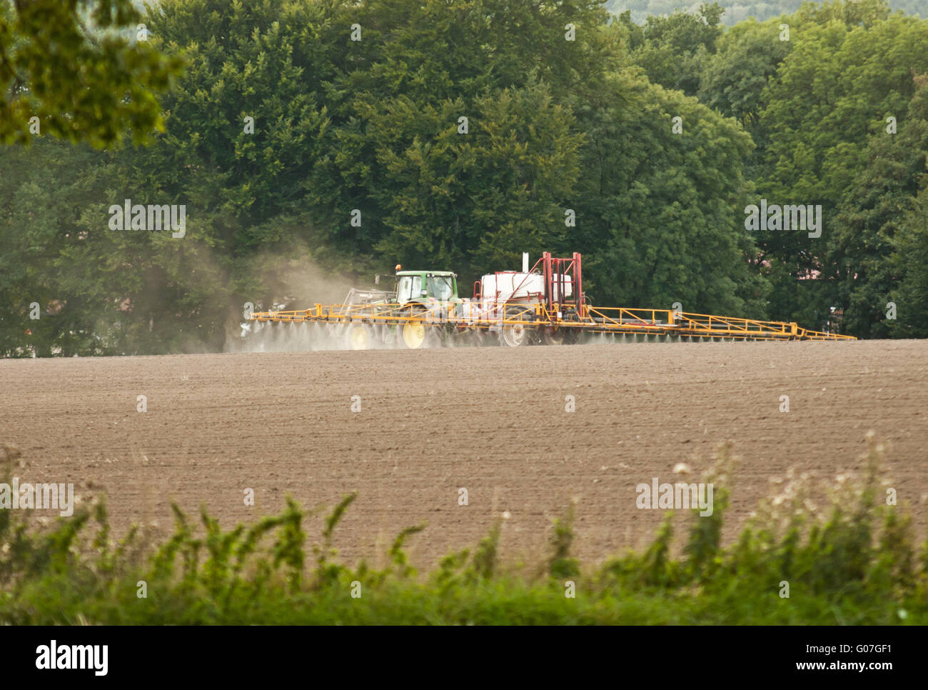 Spraying on fields Stock Photo - Alamy
