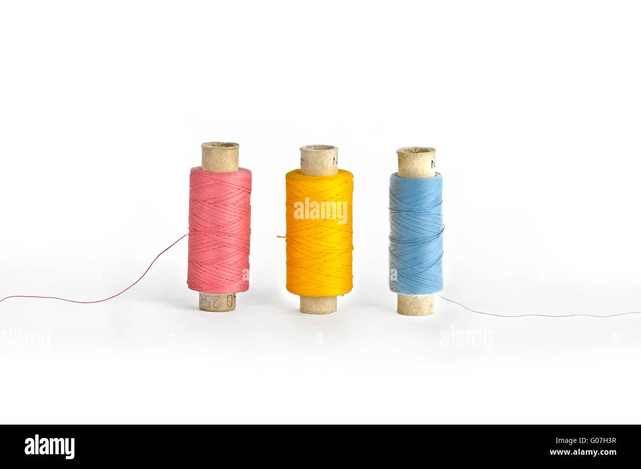 Three colorful spools of thread Stock Photo - Alamy