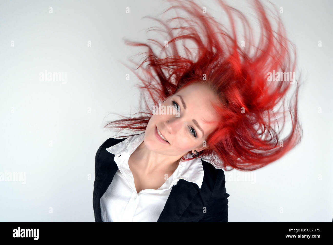 Young pretty woman with red, waving hair Stock Photo - Alamy