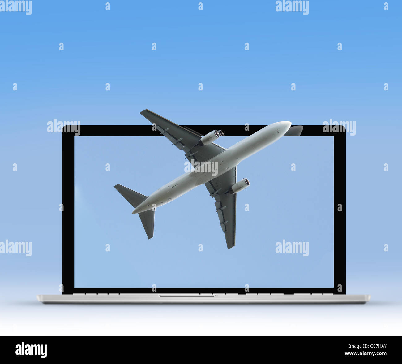 notebook with airliner flying out from screen Stock Photo - Alamy