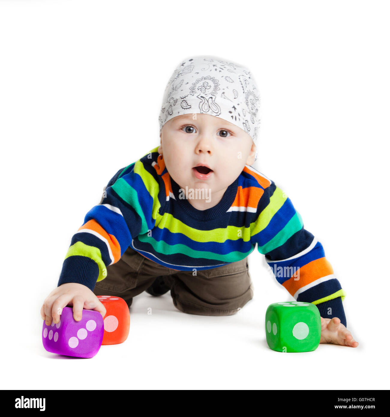 baby is playing with toys over white background Stock Photo - Alamy