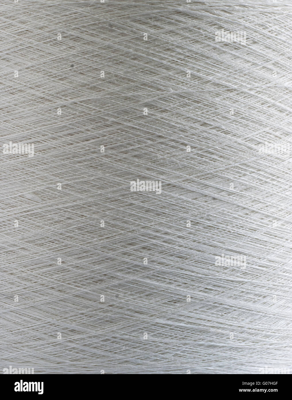 White linen yarn bobbin closeup detail as backgrou Stock Photo - Alamy