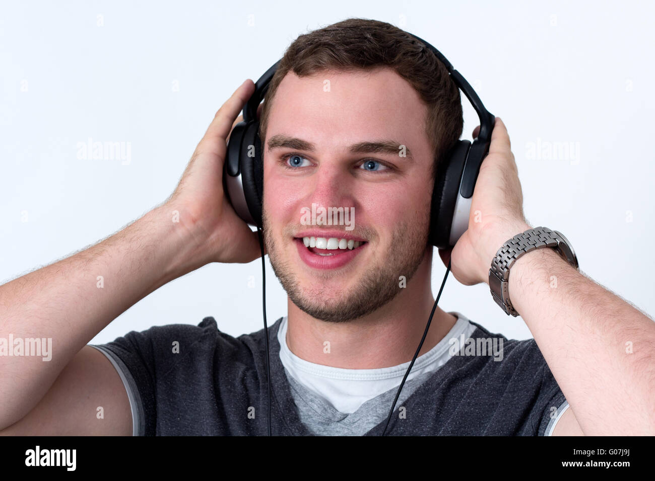 Close Up of Face of young man listening to music Stock Photo - Alamy