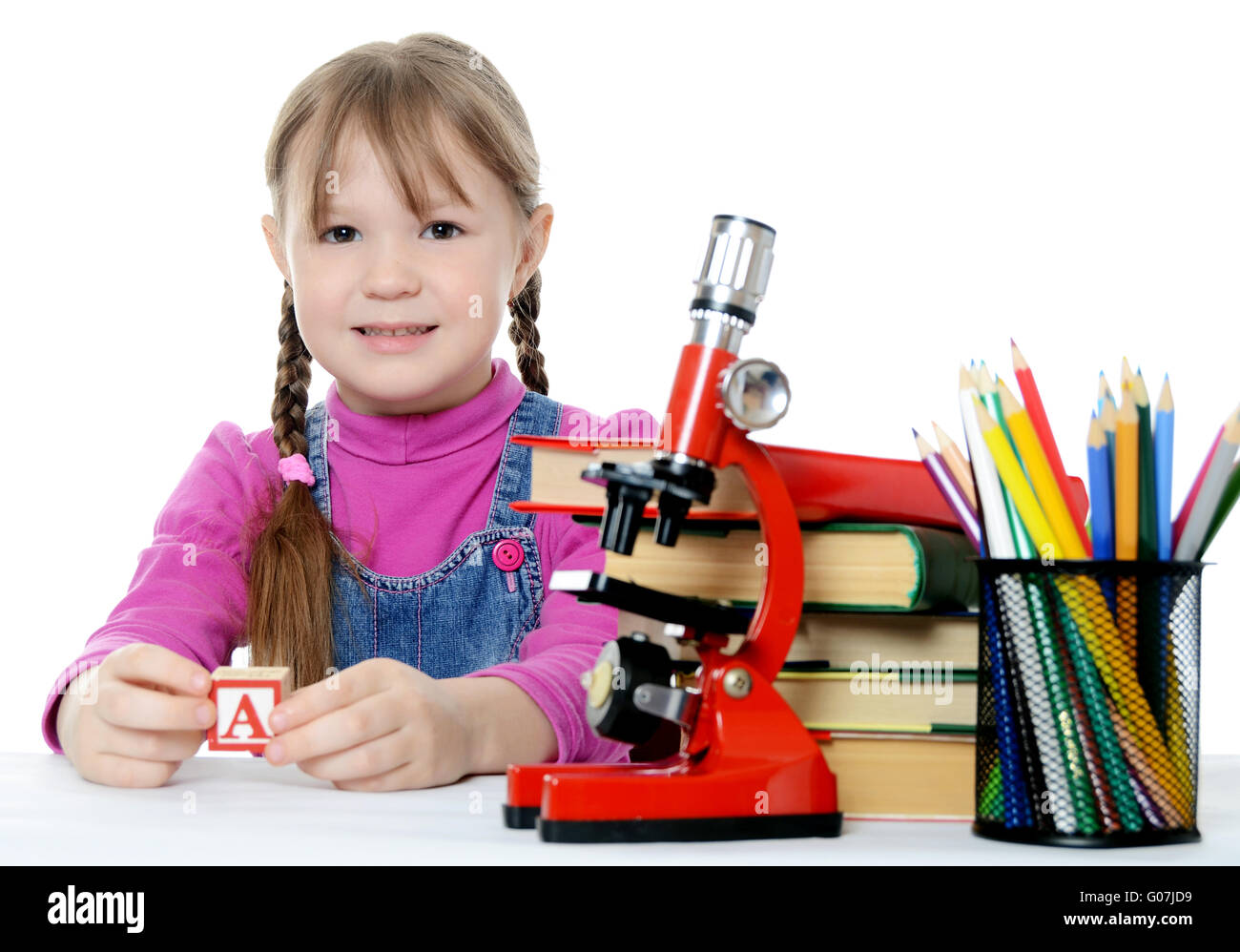 The little girl learn isolated on white background Stock Photo - Alamy