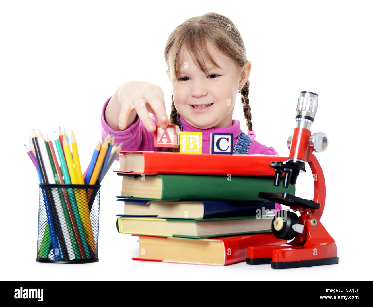 The little girl learn isolated on white background Stock Photo - Alamy